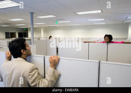office workers talk over cubicle walls Stock Photo - Alamy