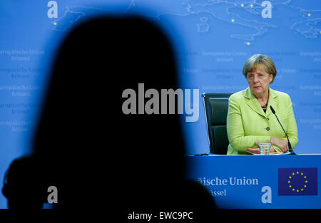 German Chancellor Angela Merkel listens to the debate about her policy ...