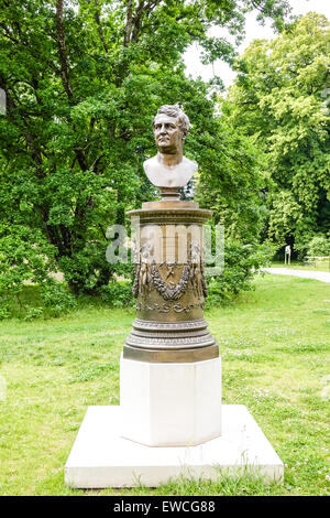 Statue of man on plinth in English garden Stock Photo - Alamy
