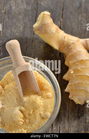 Ground ginger root on a wooden table, close up Stock Photo - Alamy