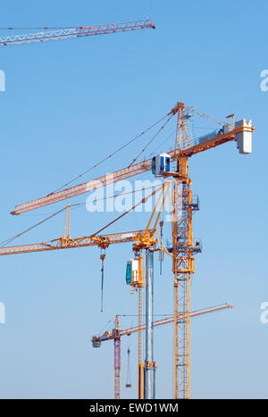 Construction cranes on building site at sunset in Cape Town, South ...