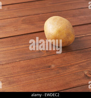 Single brown potato composition Stock Photo - Alamy