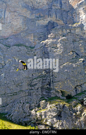 A BASE jumper in the Lauterbrunnen Valley. Lauterbrunnen, Switzerland ...