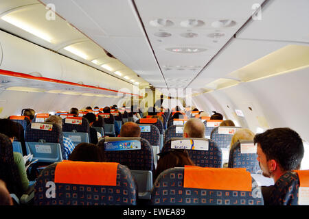 Passengers inside cabin of EasyJet Airbus A319 Stock Photo - Alamy
