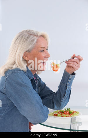ELDERLY P. EATING RAW VEGETABLES Stock Photo - Alamy
