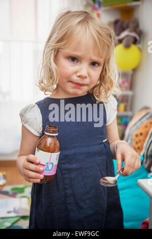 CHILD TAKING MEDICATION Stock Photo - Alamy