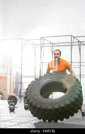 Man standing strong in the gym and flexing muscles Stock Photo - Alamy