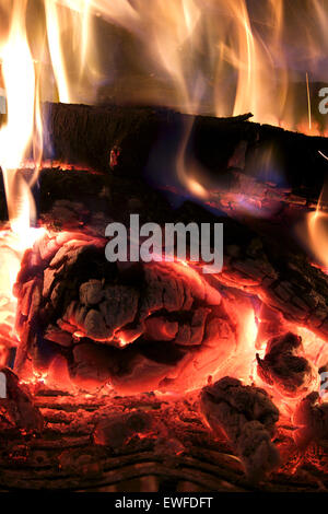 Crest of flame on burning wood in fireplace Stock Photo - Alamy