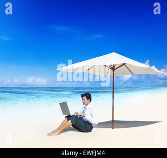 Business Man Working on Tropical Beach Stock Photo - Alamy