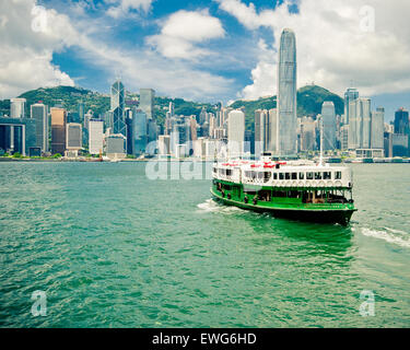 Hong Kong skyline over Victoria Harbour under a stormy sky Stock Photo ...