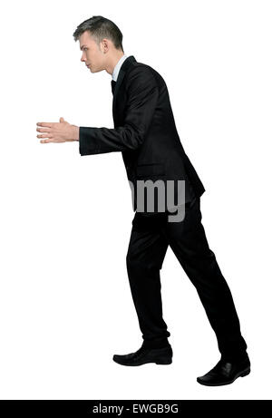 Isolated business man pushing nothing Stock Photo - Alamy