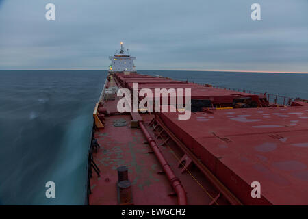 bulk laker ship underway at sunset Stock Photo - Alamy