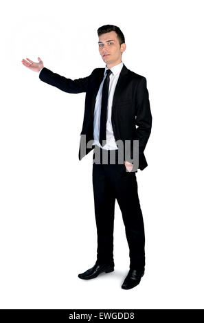 Handsome adult man introduce product, looking and pointing fingers left ...