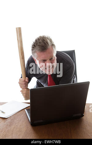 businessman getting very mad about to hit his computer with a baseball ...