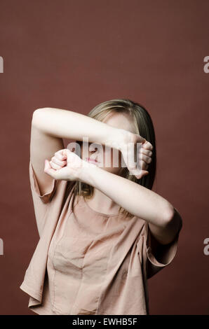 Scared woman in danger hiding face with hands Stock Photo: 84492982 - Alamy