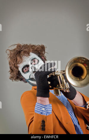 Professional trumpet player with face painted as human skull Stock ...