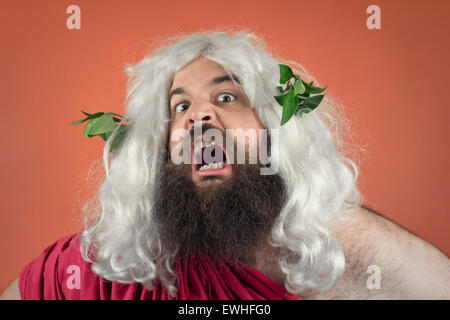 Angry yelling wrath of god against orange background Stock Photo - Alamy