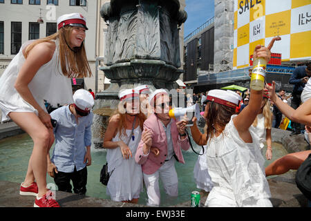 Students in a a fountain celebrating graduating from high school in ...