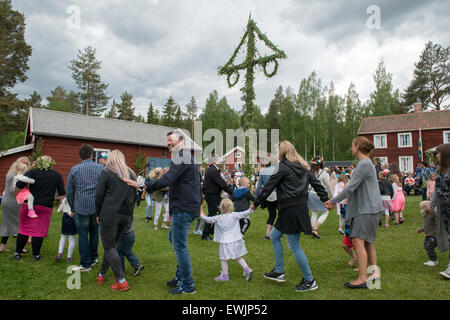 People dancing around midsummer maypole Stock Photo - Alamy