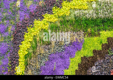 Retail building with colourful plants forming the wall cladding Stock ...