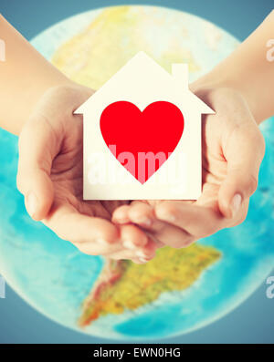 Human hands with paper planet Earth on color background Stock Photo - Alamy