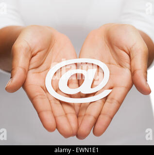 womans cupped hands showing e-mail cutout sign Stock Photo - Alamy