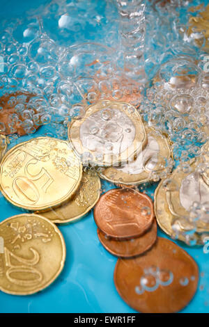 Water price concept with euro currency coins and water drops, vertical ...
