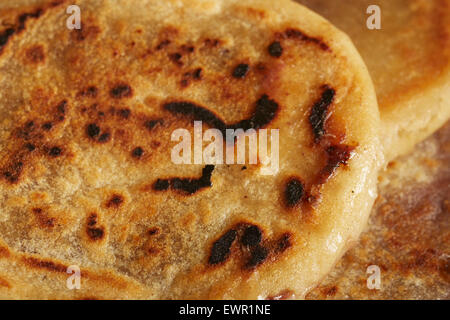 Pupusas, a typical Salvadoran street food made from corn, being cooked ...