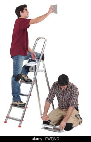 A tiler and his apprentice Stock Photo - Alamy