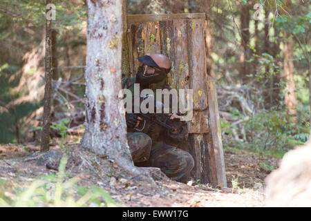 Paintball player wearing protecting mask Stock Photo - Alamy