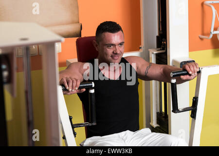Weightlifter on Exercise Machine Stock Photo - Alamy