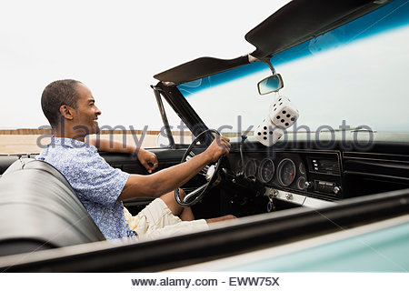 Man driving convertible car Stock Photo - Alamy