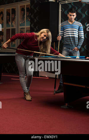 Man Teaching Woman How To Play Pool Stock Photo - Alamy