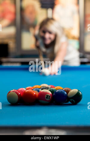 Woman aiming to break up the pool balls Stock Photo - Alamy