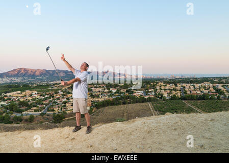 Guy making a fool of himself taking a selfie Stock Photo - Alamy