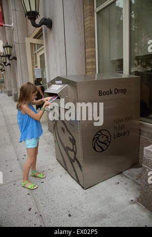 Public library book return drop box Stock Photo - Alamy