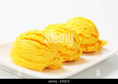 Scoops of mango ice cream with fruit Stock Photo - Alamy