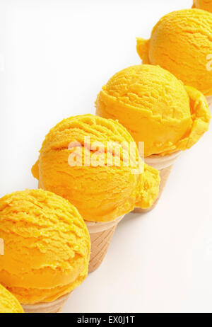 Yellow ice cream cones arranged in a row Stock Photo - Alamy
