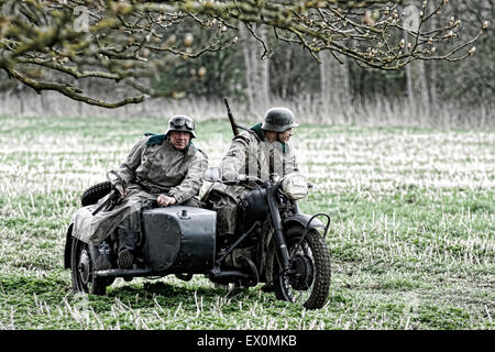 German WW2 soldiers riding on BMW military motorcycle with sidecar ...
