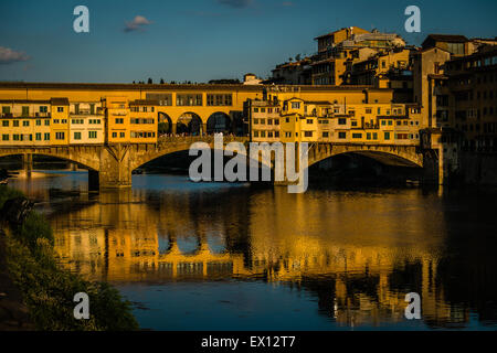 Ponte Vecchio yellow historical Bridge in Florence over the Arno River, Tuscany, Italy Stock ...
