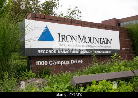 A logo sign outside the headquarters of the Iron Mountain Records ...