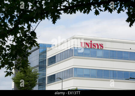 A logo sign outside of the headquarters of Unisys Corporation in Blue ...