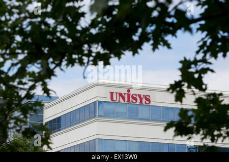 A logo sign outside of the headquarters of Unisys Corporation in Blue ...