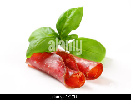Slices of smoked marinated beef - rolled up Stock Photo - Alamy