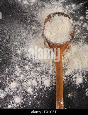 Flour on old wooden table. Top view Stock Photo - Alamy