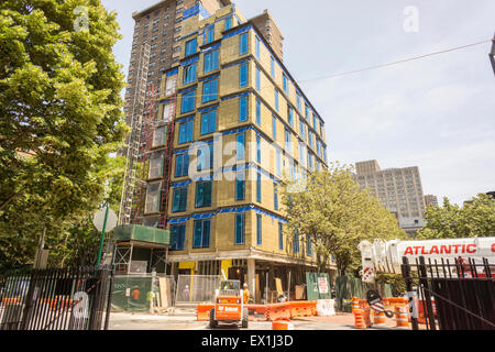 Construction on nARCHITECTS micro-unit modular apartments, branded ...