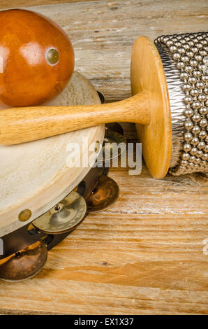 Several small percussion instruments on a rustic wooden surface Stock ...
