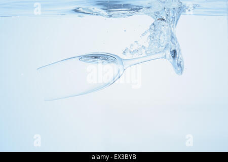 Champagne glass falling into water Stock Photo - Alamy