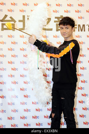 Hong Kong singer Leo Ku, right, poses at a promotional event for Hito ...