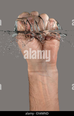 Fist punch into water Stock Photo - Alamy